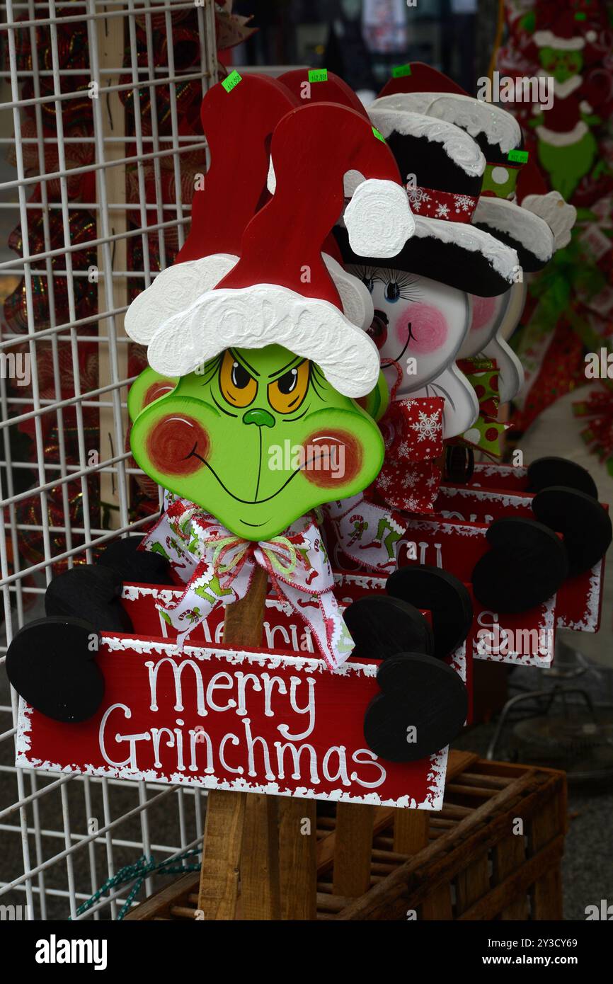 A humorous lawn sign or lawn art for sale at an art festival portraying ...