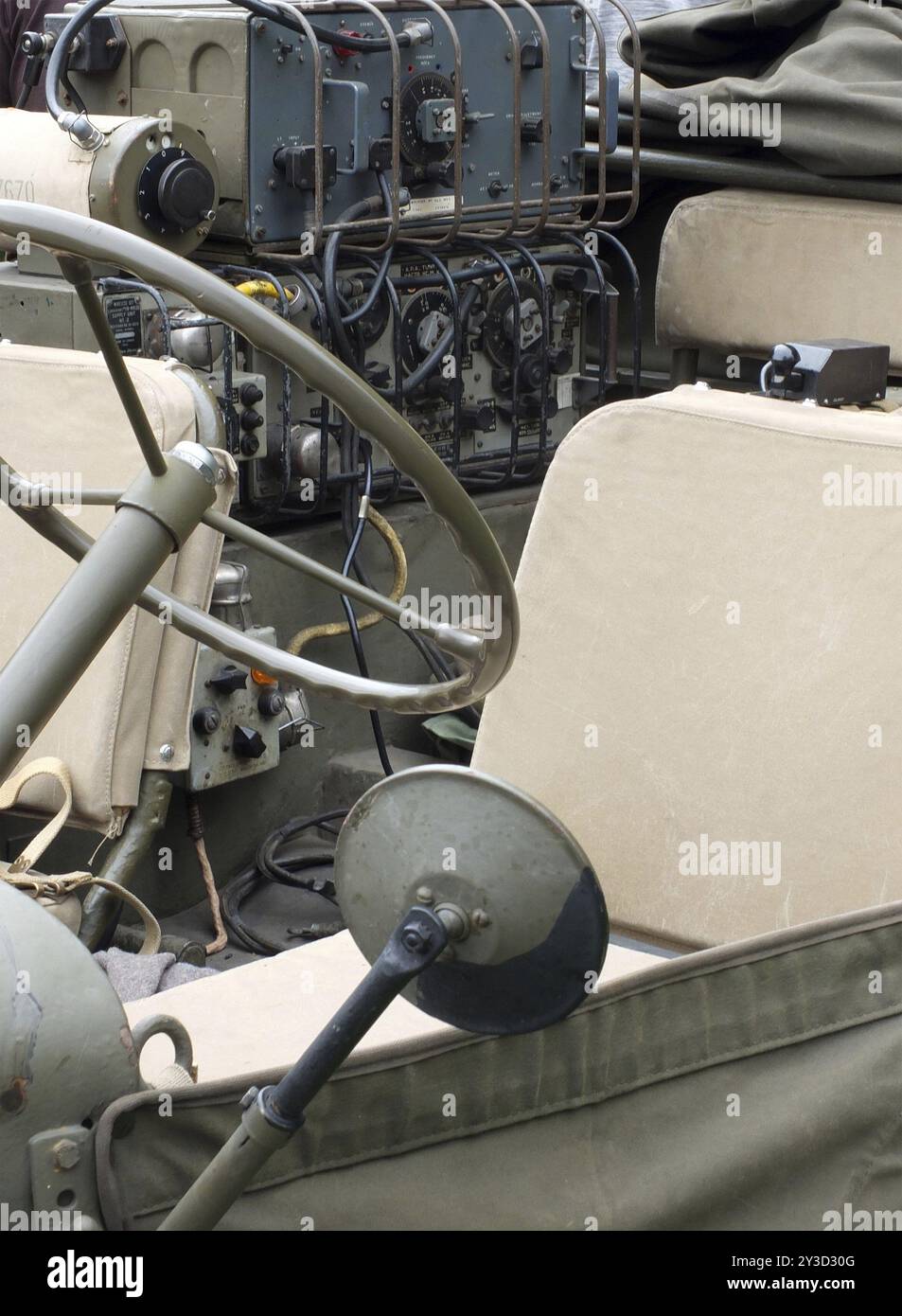 Close up of the driving wheel and radio equipment in a vintage world ...