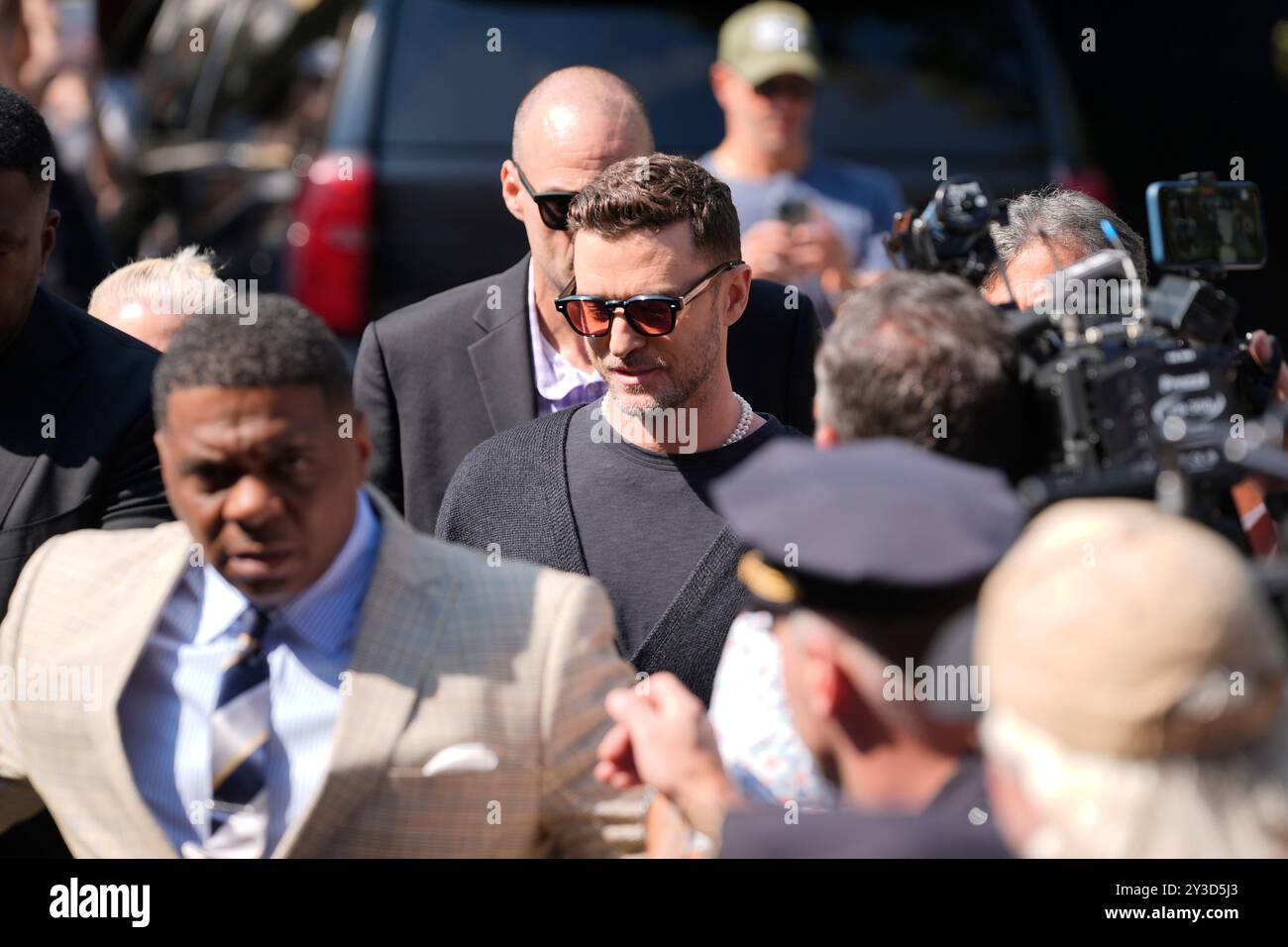 Justin Timberlake, center, walks into court for a hearing, Friday, Sept ...