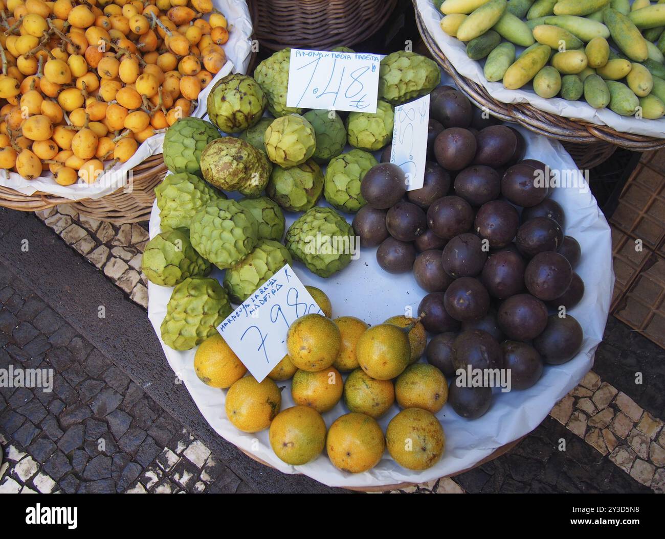 Tropical fruit in a basket on a street market stall in funchal madeira ...