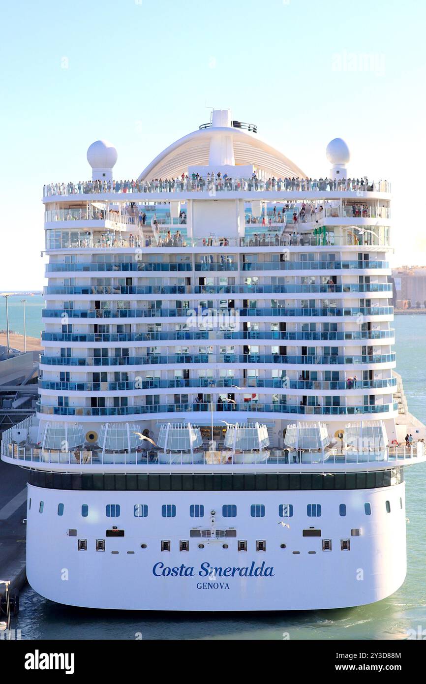 Cruise passengers line the decks of the Costa Smeralda, an Excellence ...