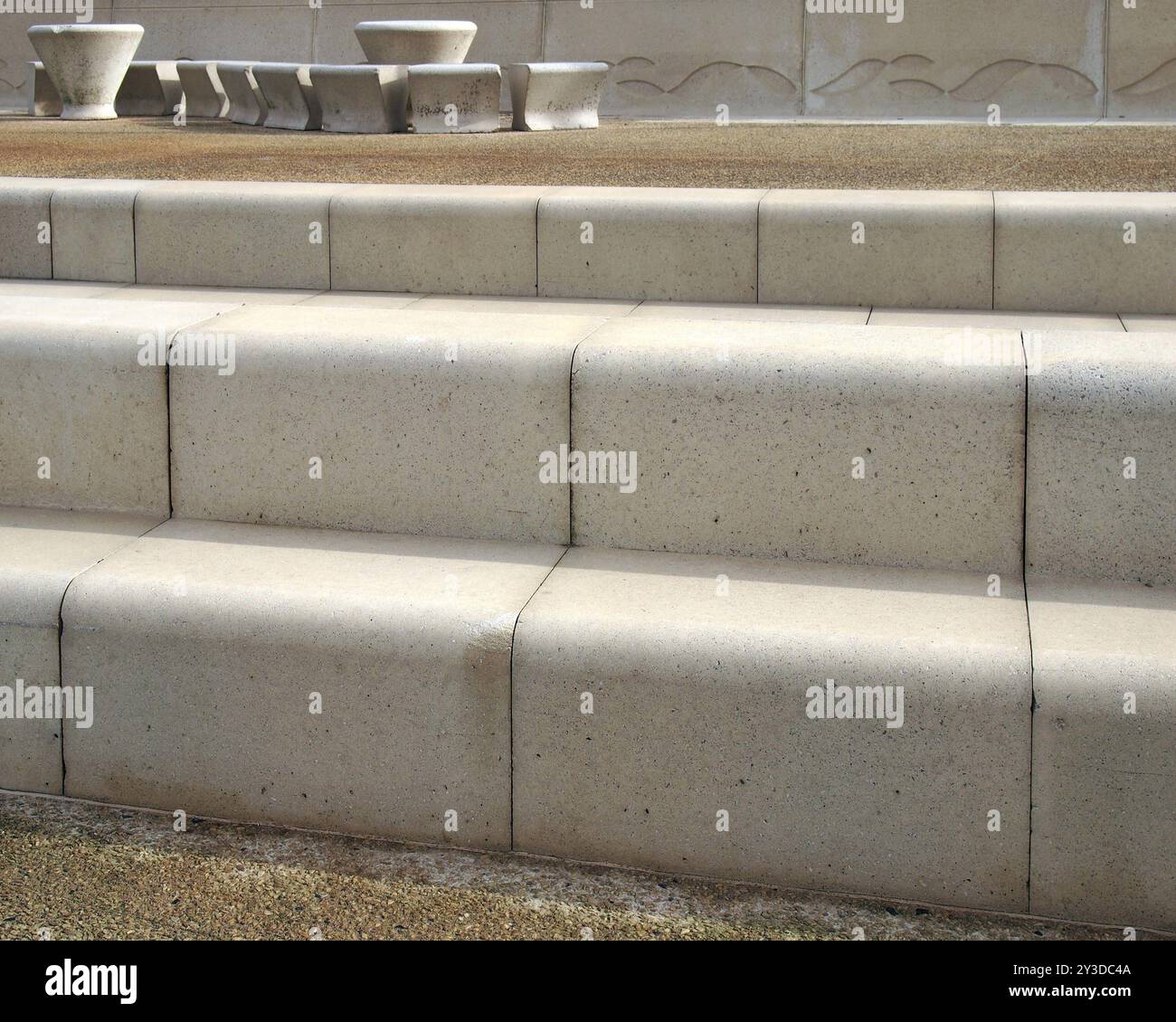 Modern angled outdoor steps with rounded corners in textured grey and ...