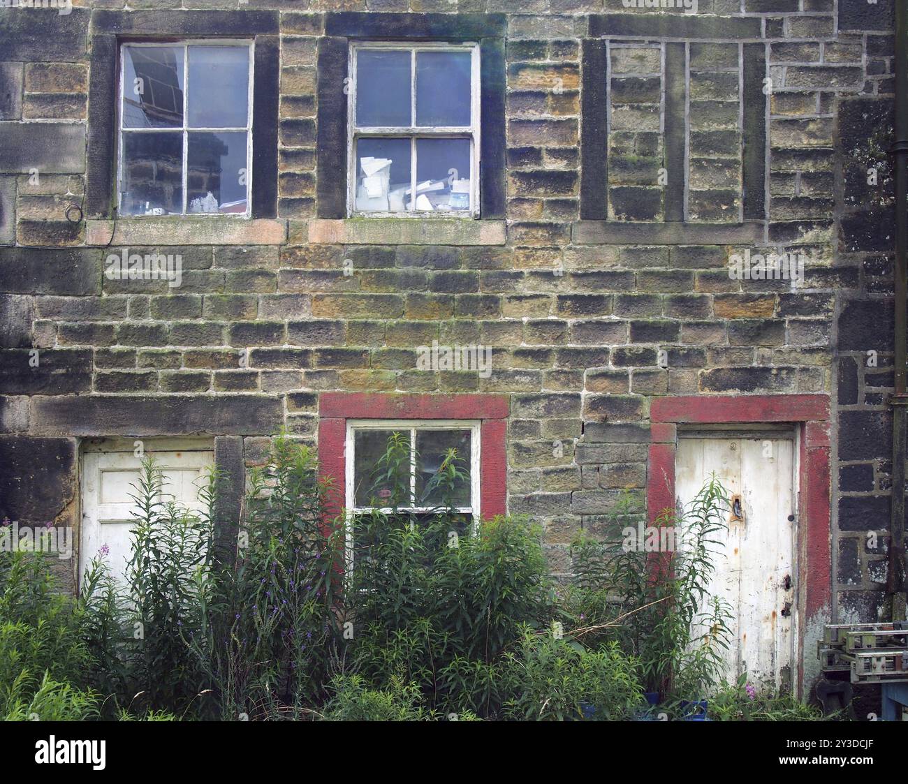 Old scruffy run down abandoned houses with shabby peeling paint and ...