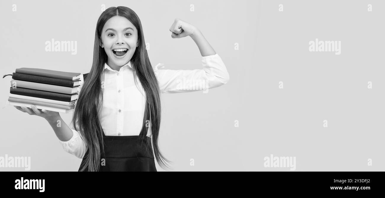 happy teen girl in school uniform hold book stack. Portrait of ...