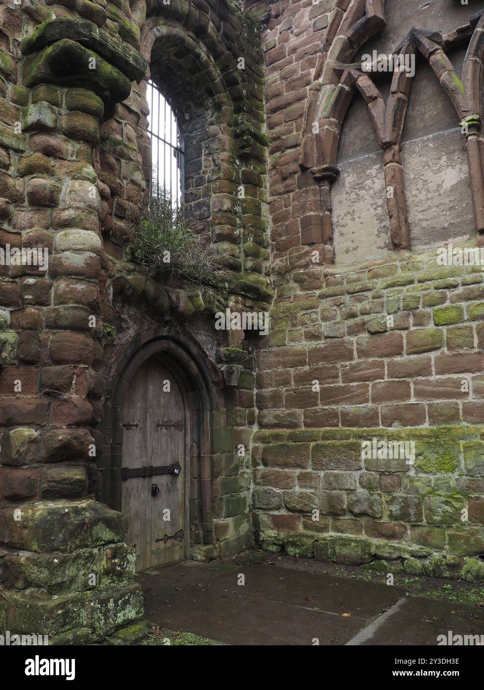 Ruined medieval stone walls of the eastern end of destroyed choir and ...