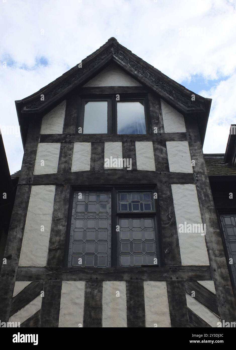 Tudor type british house with black timbers and white plaster walls and ...