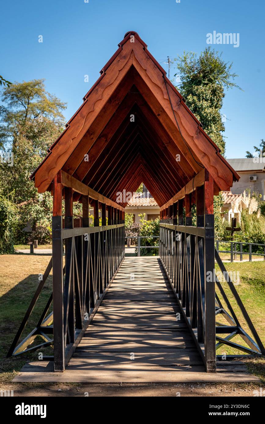 Perspective view through pedestrian bridge with wooden gable roof Stock ...