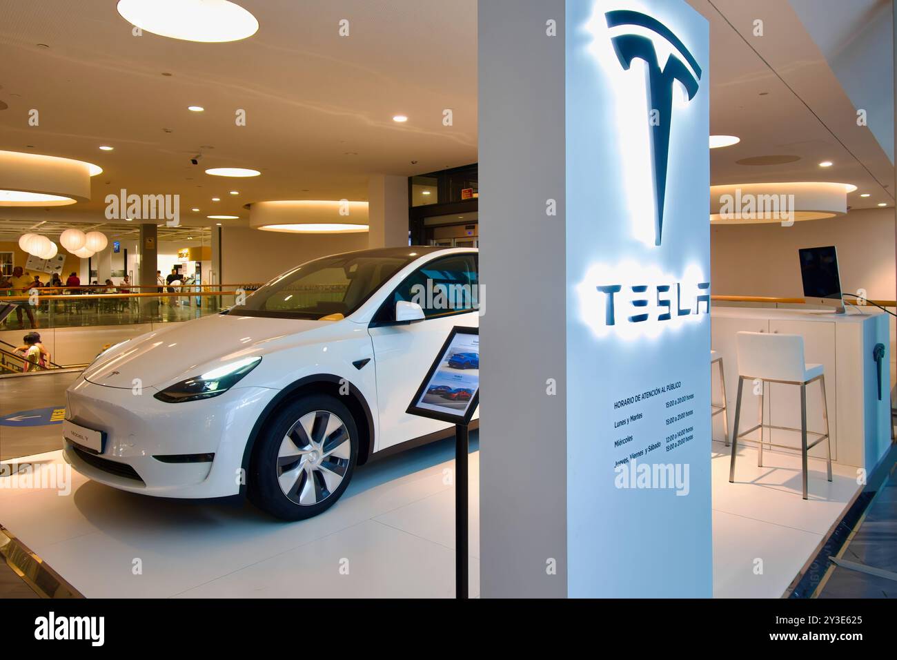 White Tesla Model Y Crossover battery electric vehicle car on a sales ...