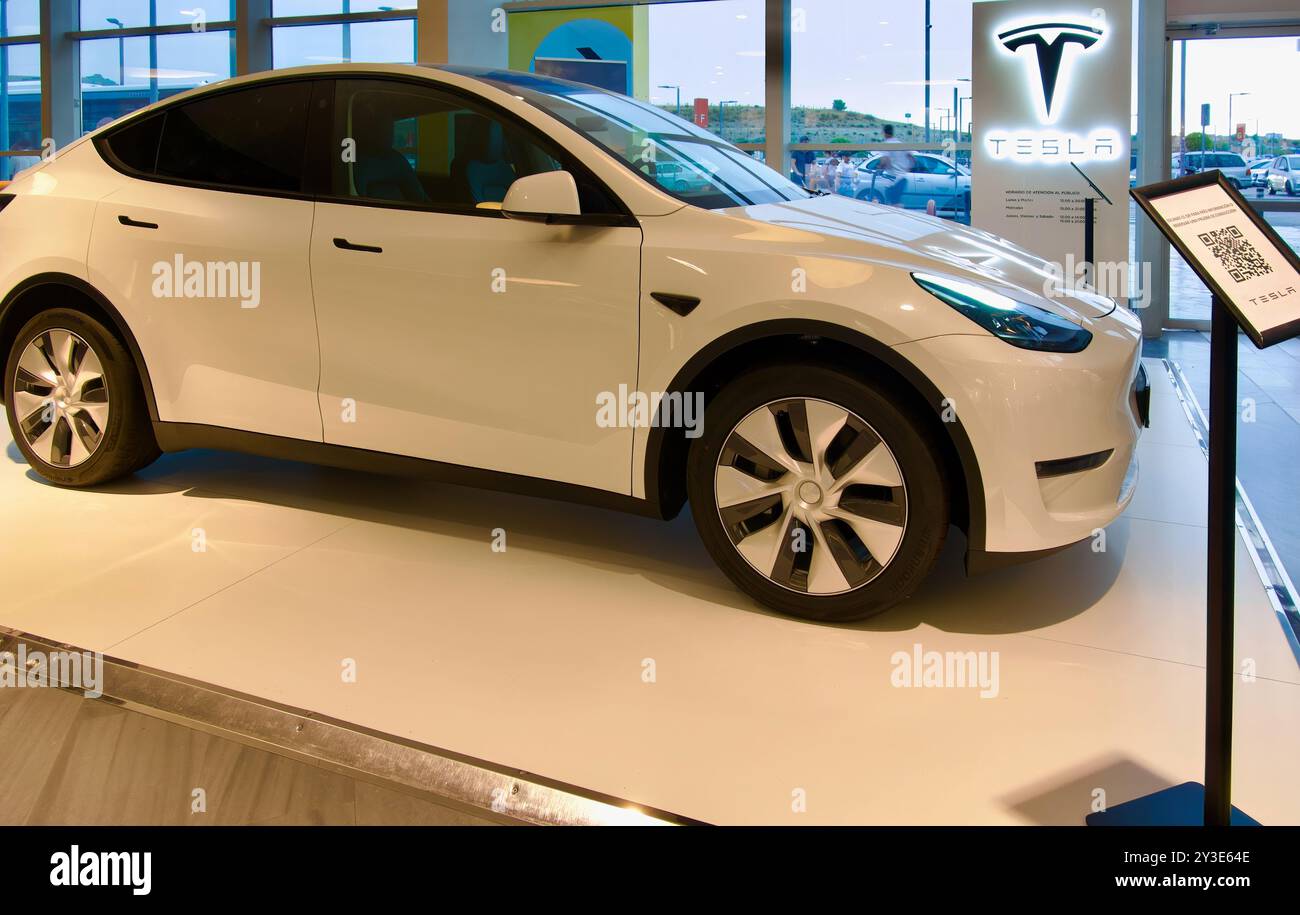 White Tesla Model Y Crossover battery electric vehicle car on a sales ...