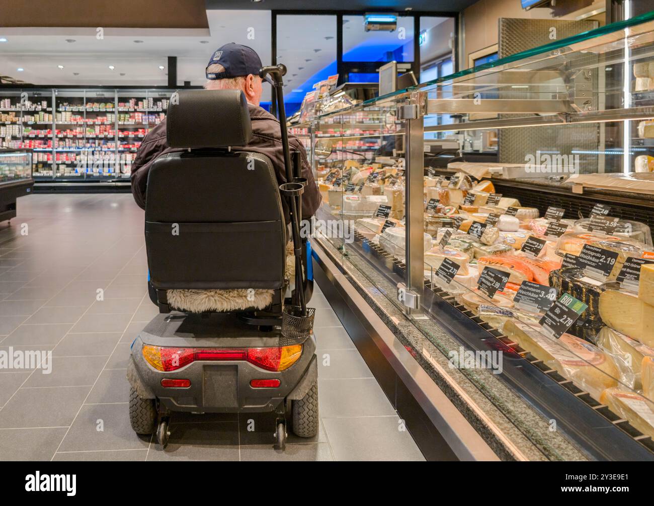 Hamburg, Germany. 10th Aug, 2024. A man in an electric wheelchair looks ...