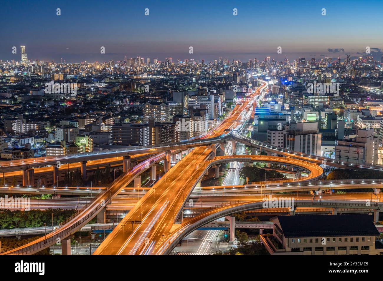 East Osaka, Japan aerial cityscape with junctions and highways at blue ...