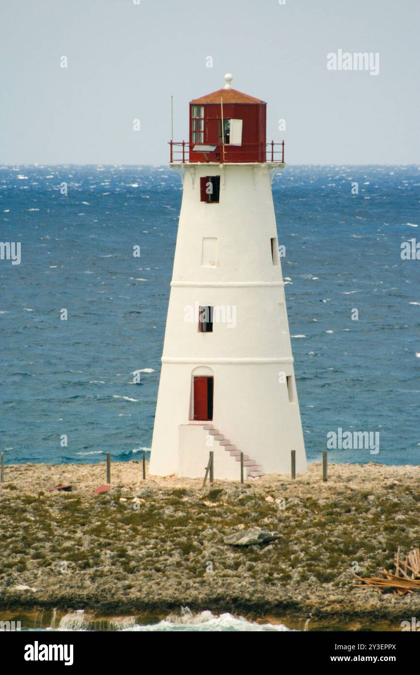 A view of the Hog Island Lighhouse in Nassau Bahamas with stormy seas ...