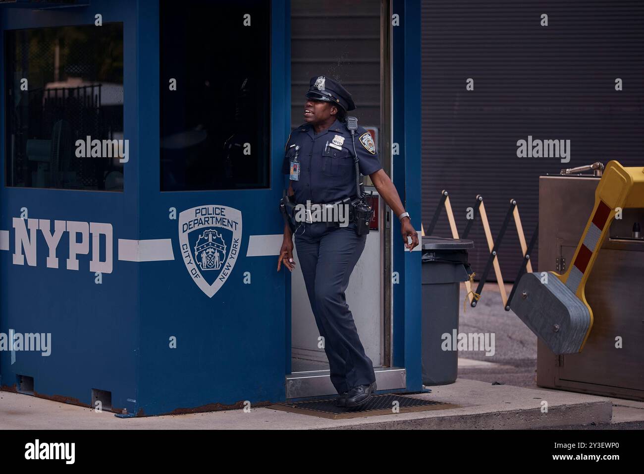 A police officer stands guard outside One Police Plaza NYPD ...