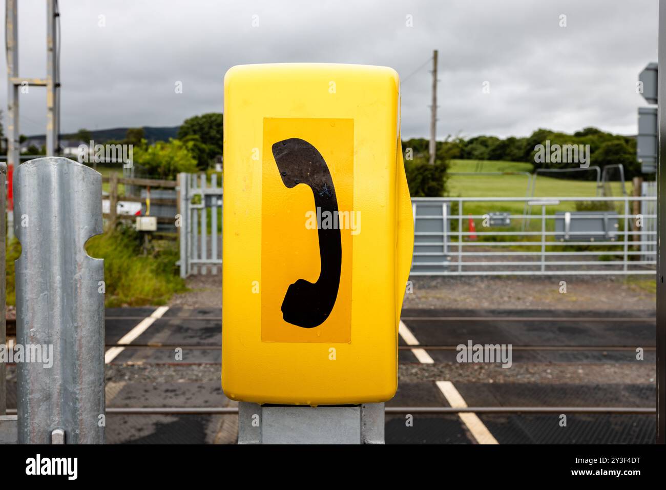 Landscape orientation of a yellow phone call point at an unmanned level ...
