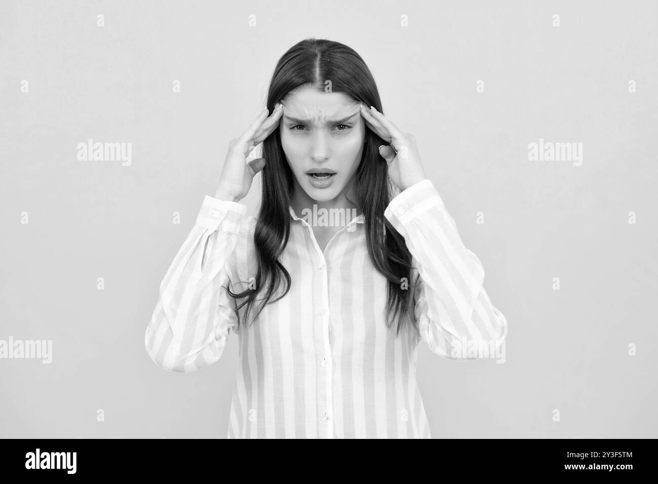 Exhausted tired girl desperate and stressed because pain and migraine. Upset sad depressed model ...