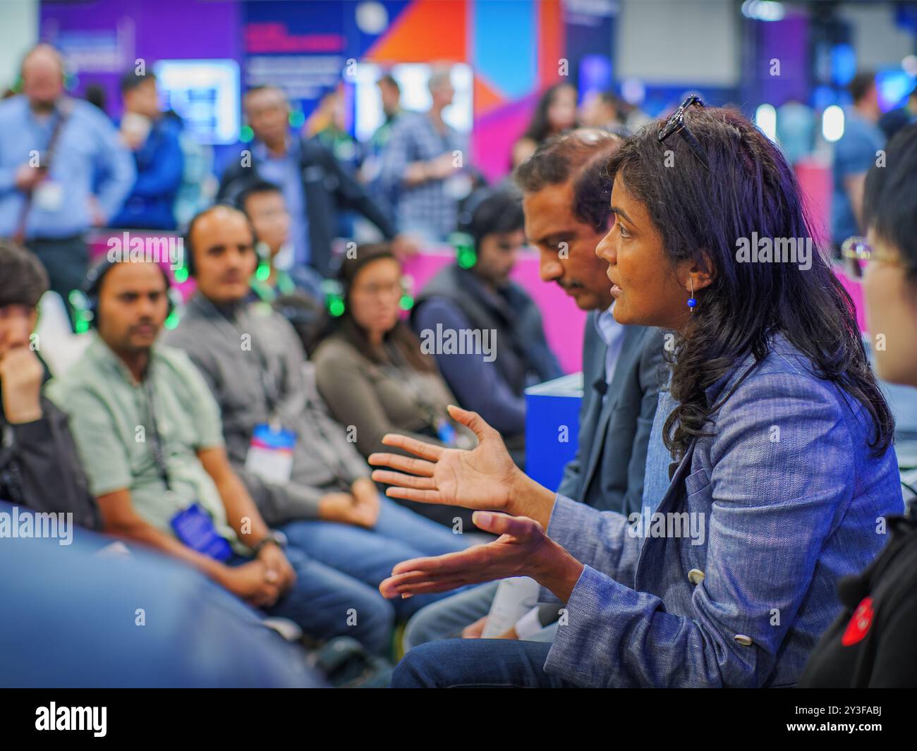 LOS ANGELES, CA- May 22, 2024: Female speaker interacting with diverse ...