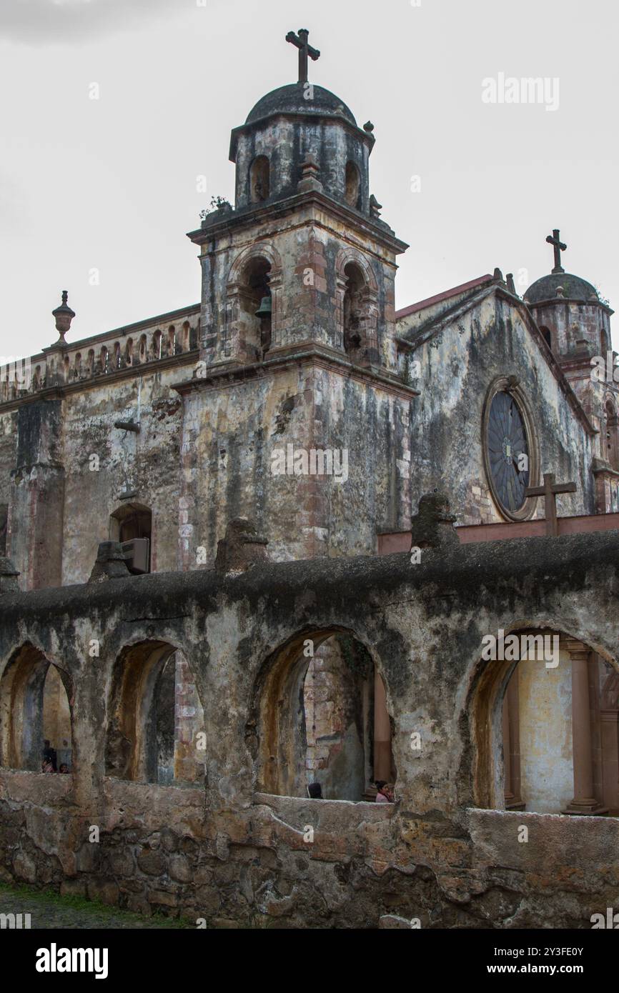 A Christian convent with a chapel in the background. A cobblestone ...