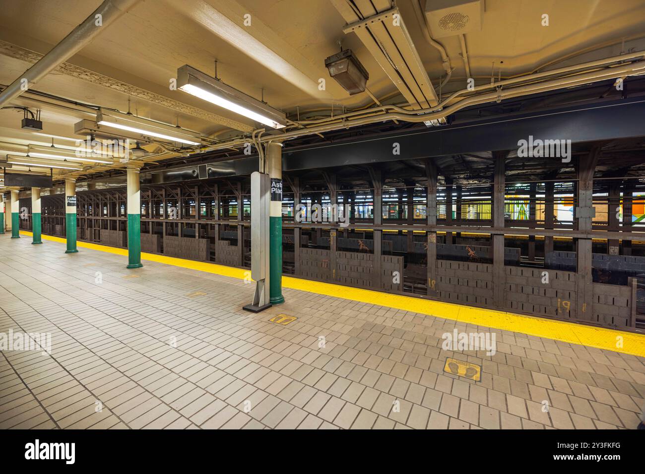 Empty subway platform at Astor Place station in New York City with view ...