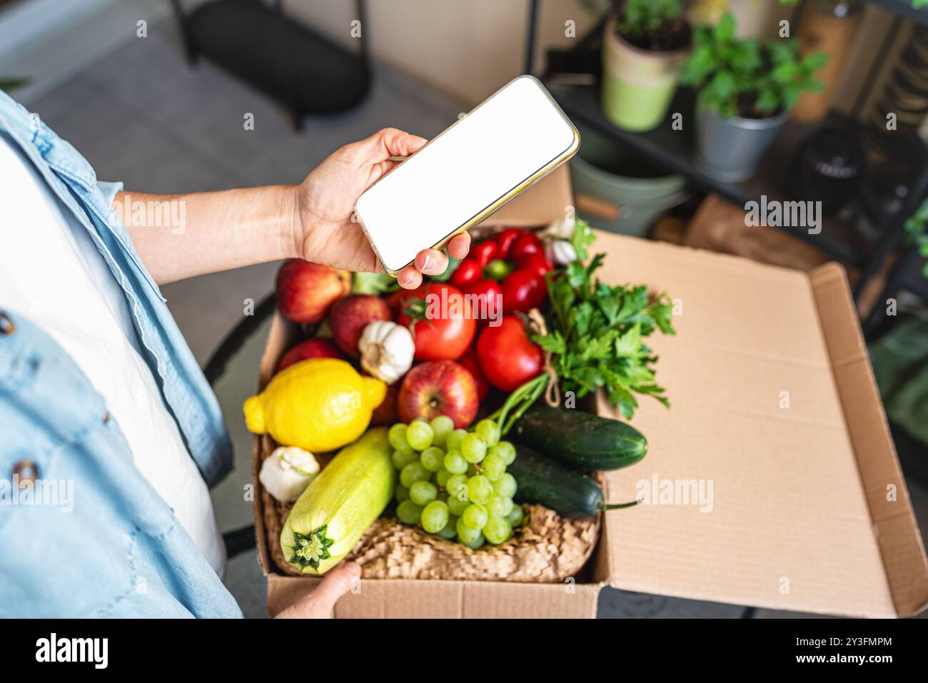 Mockup mobile app ordering farm grown vegetables. Mobile phone with ...
