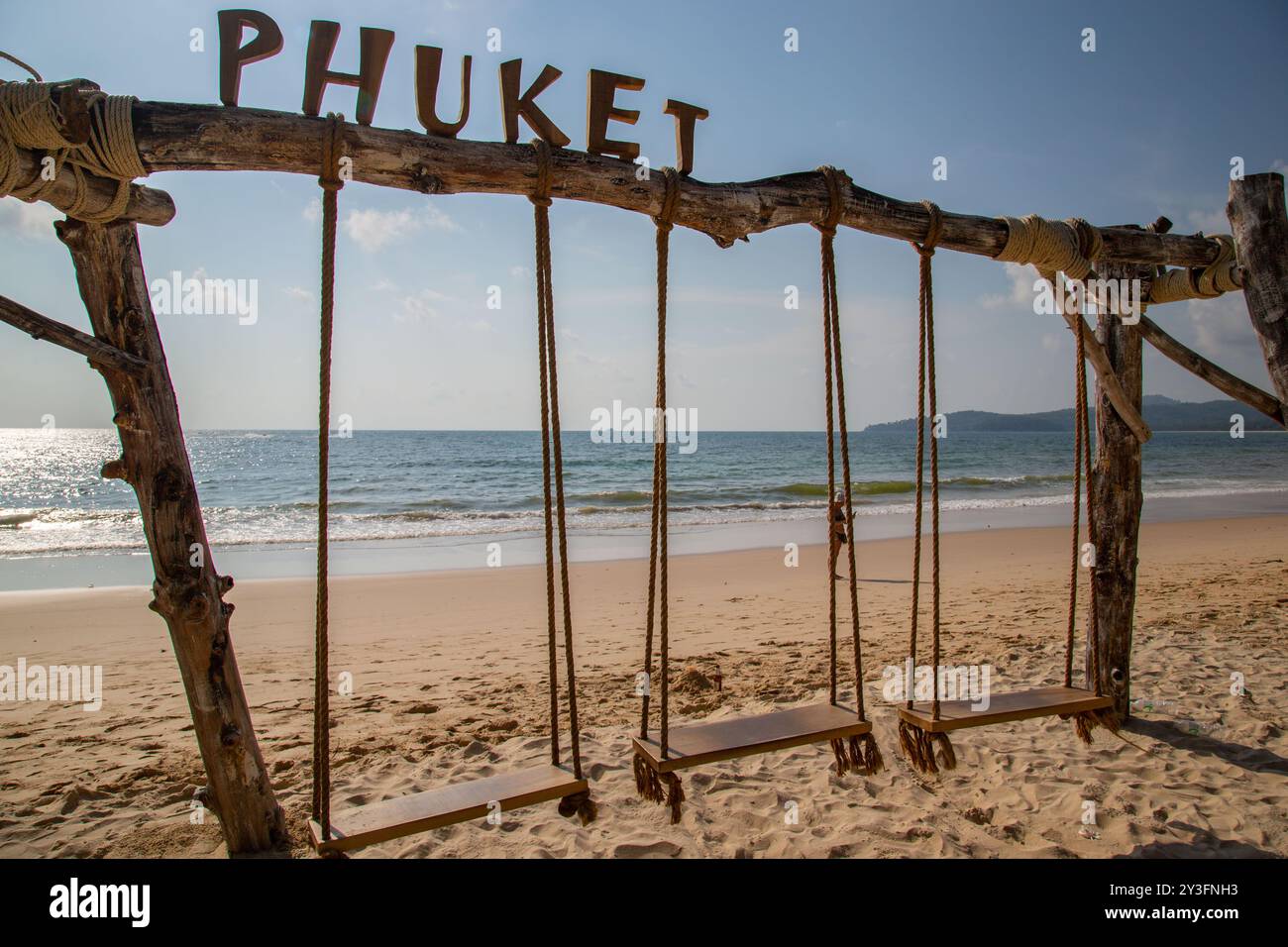 a set of swings overlook the beach at a bar in Phuket, Thailand Stock ...