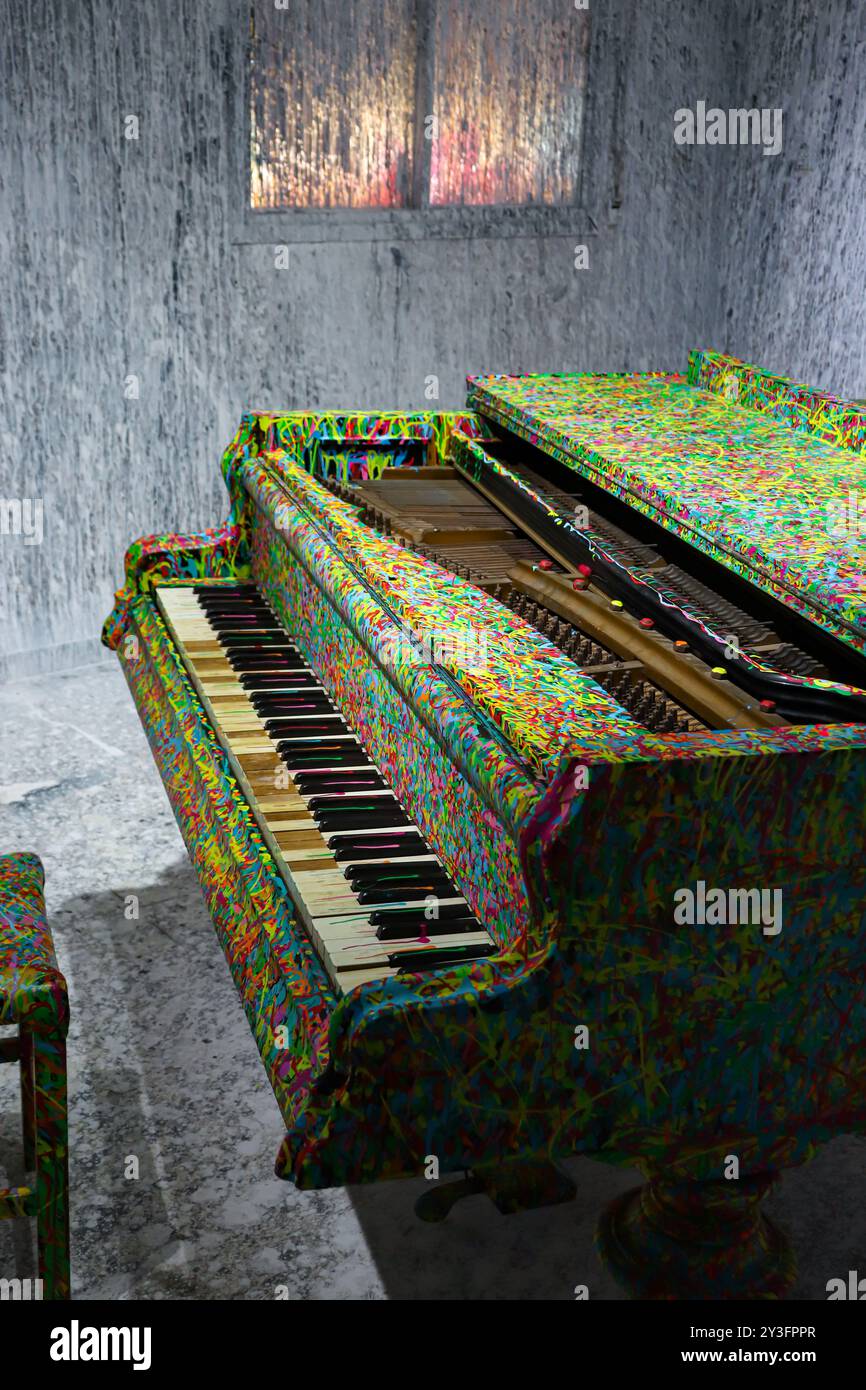 colorful paint splatter piano sitting in the “Color hunter", house of ...