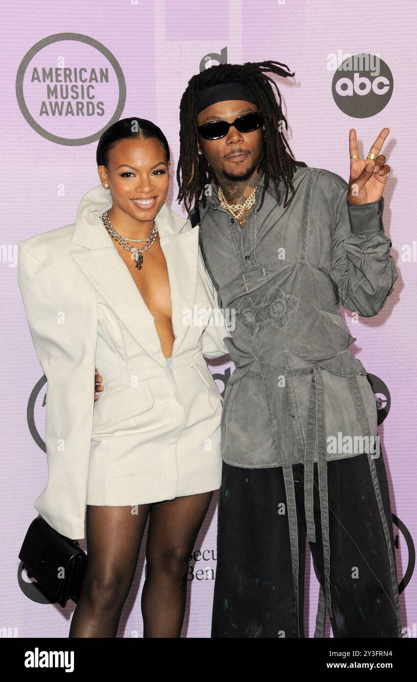 Barbara Wilson and JID at the 2022 American Music Awards held at the ...