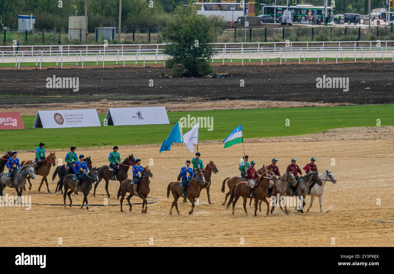 The Kazakh and Uzbek horse riders at kokpar (kok boru) game, a ...