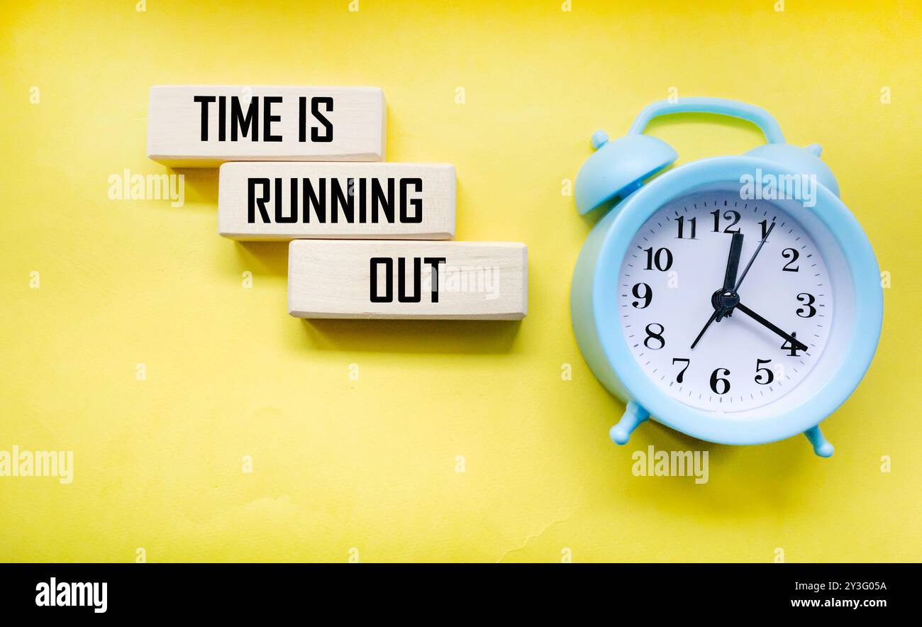 Time symbol is running out. Conceptual words Time is running out on ...