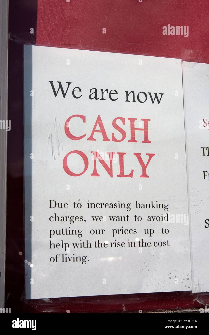 a we are now "cash only" sign in shop window in Yorkshire, England ...