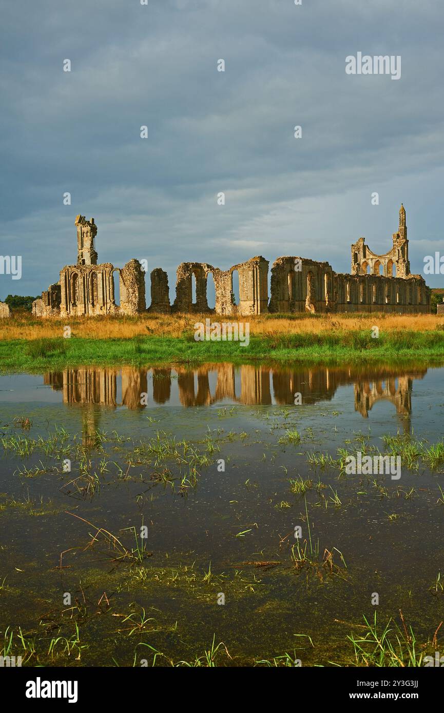 Byland Abbey in North Yorkshire. The ruins of the abbey are reflected ...
