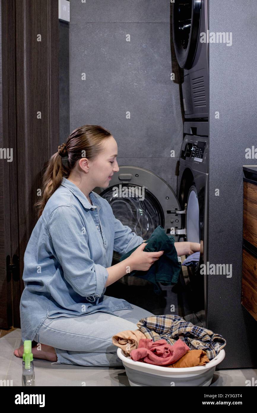 Woman housewife takes laundry out hi-res stock photography and images ...