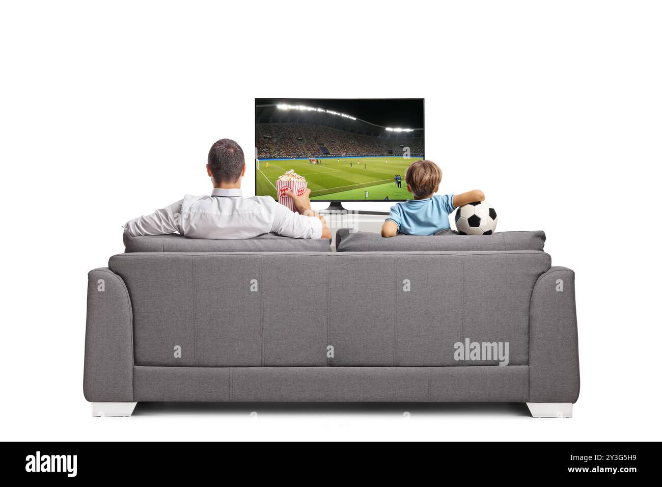 Rear view shot of a father and son watching football on tv isolated on white background Stock ...