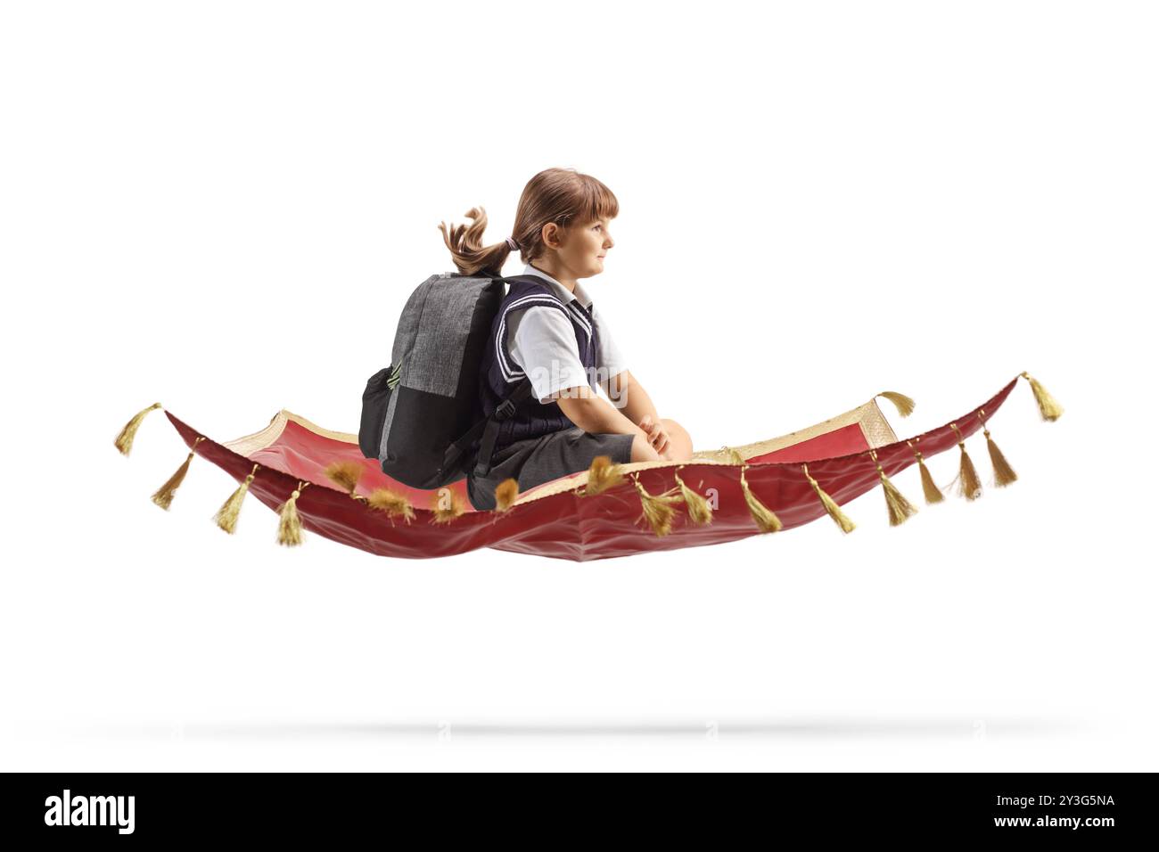 Schoolgirl with a backpack flying on a magic carpet isolated on white ...