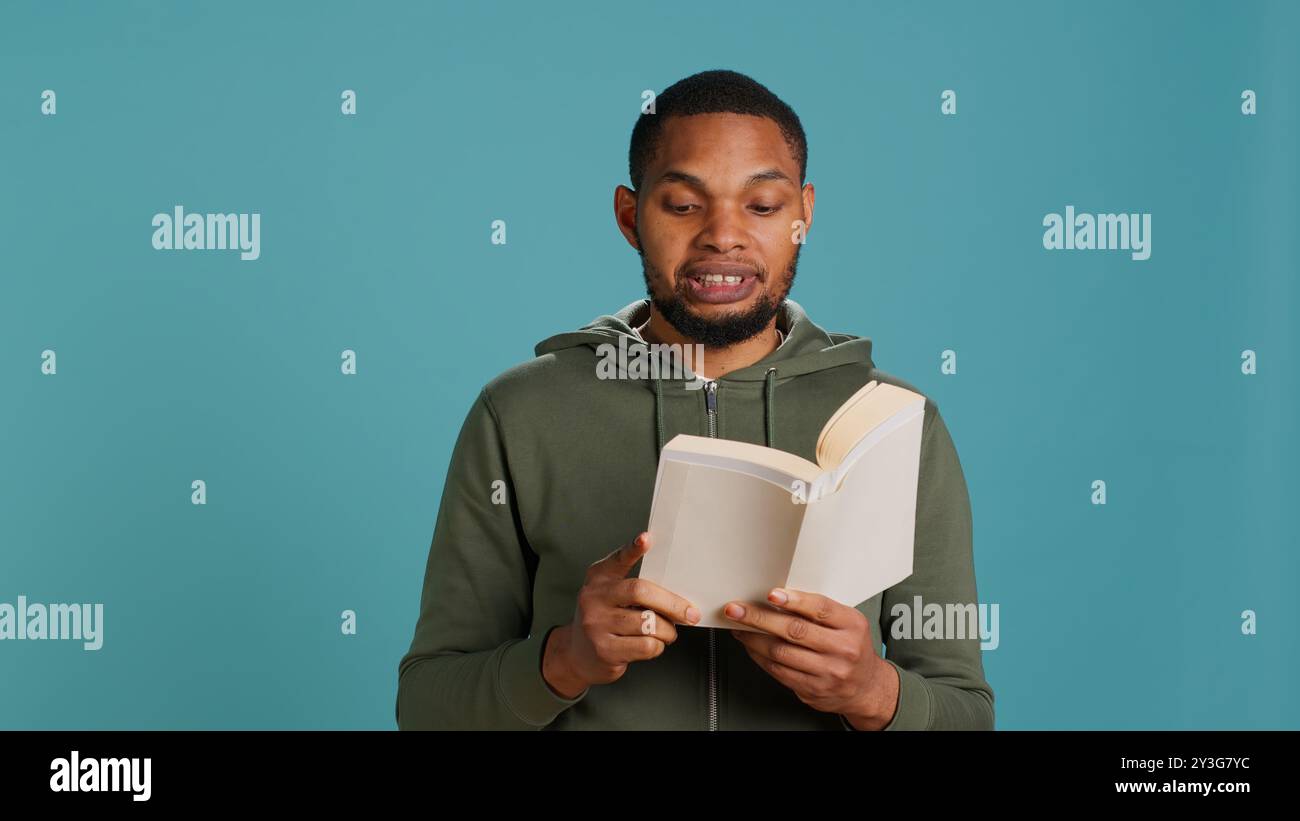 Man reading book aloud, narrating story for audience. Person enjoying ...