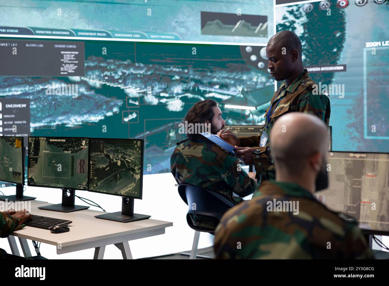 Commander and his squad operating satellite systems via CCTV and radar ...