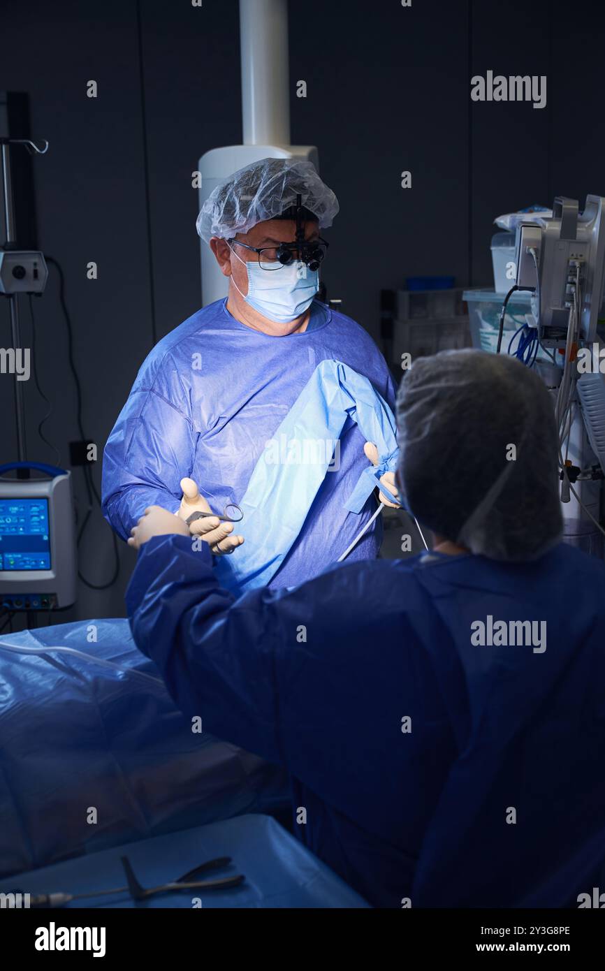 Surgical team working together in operating room Stock Photo - Alamy