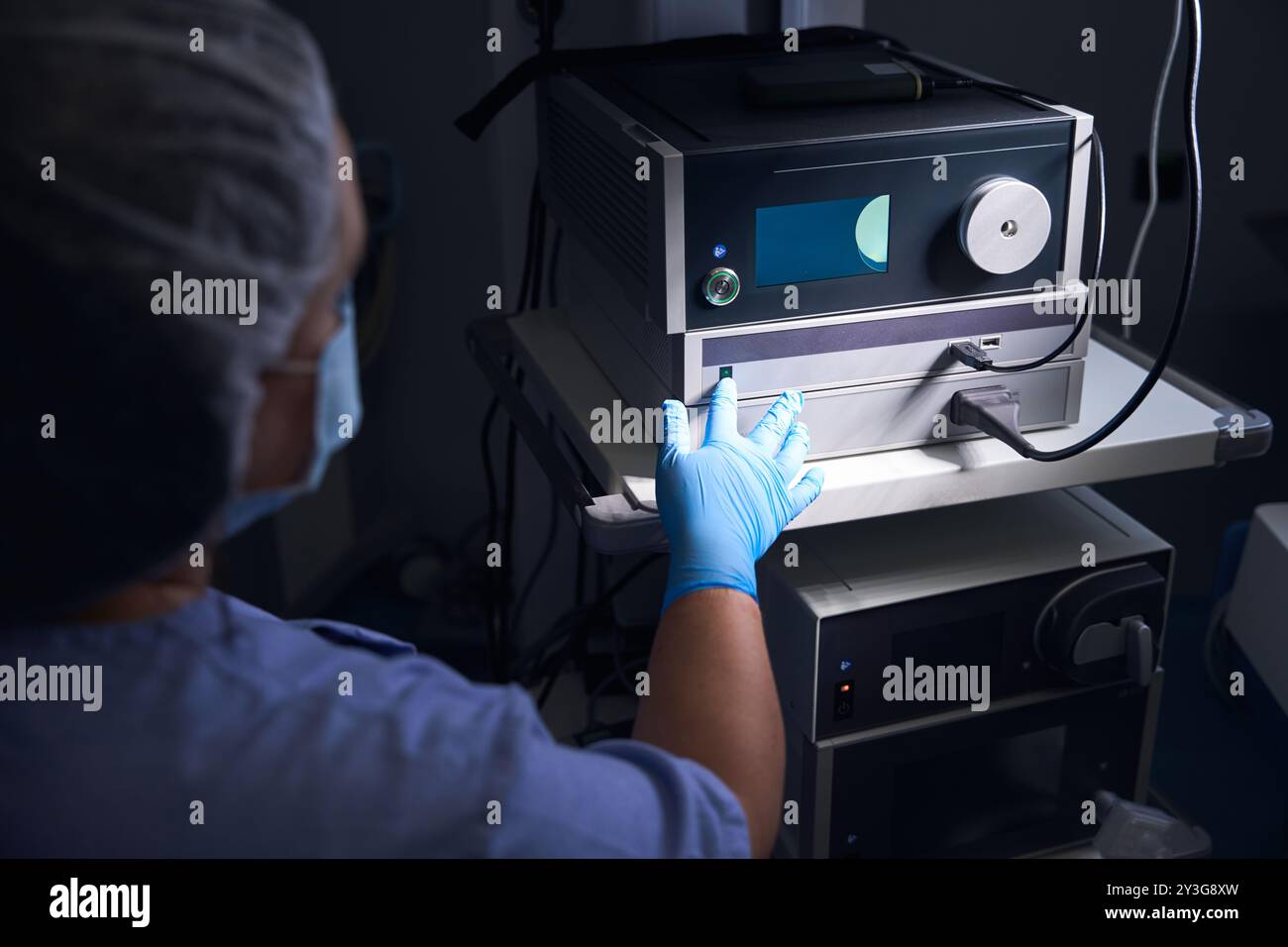 Surgeon calibrating medical device before procedure Stock Photo - Alamy