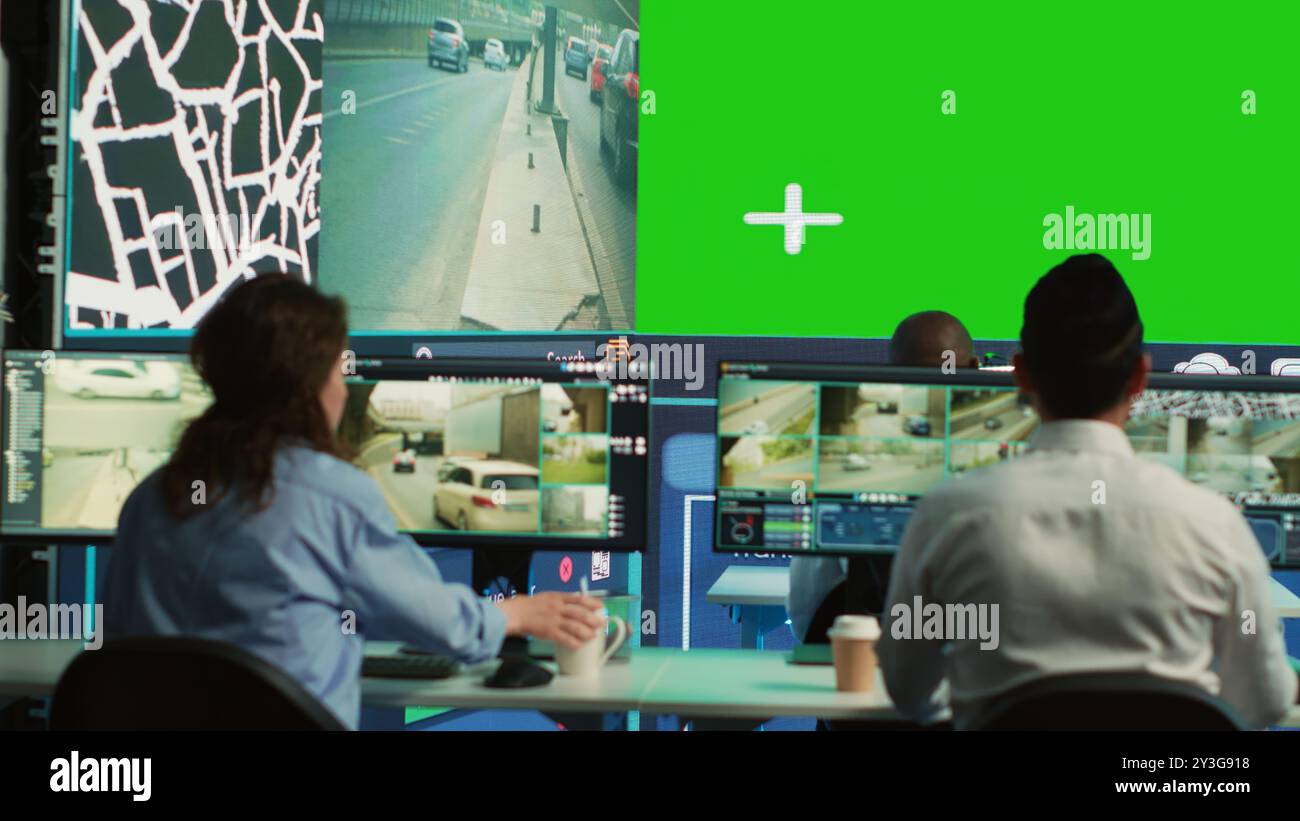 Group of employees monitoring delivery trucks routes with an isolated ...