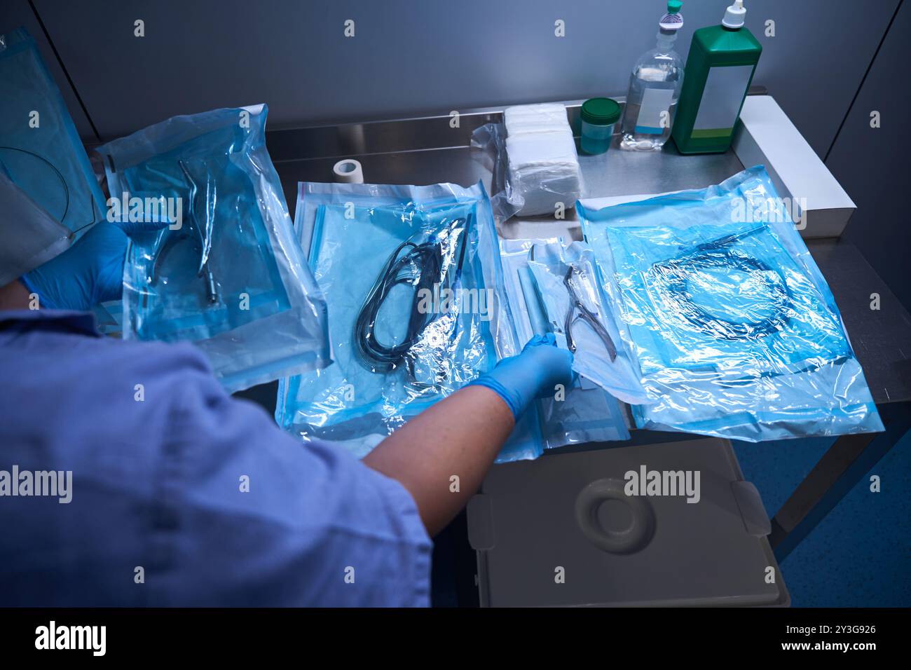 Medical staff organizing sterile instruments on preparation table Stock ...