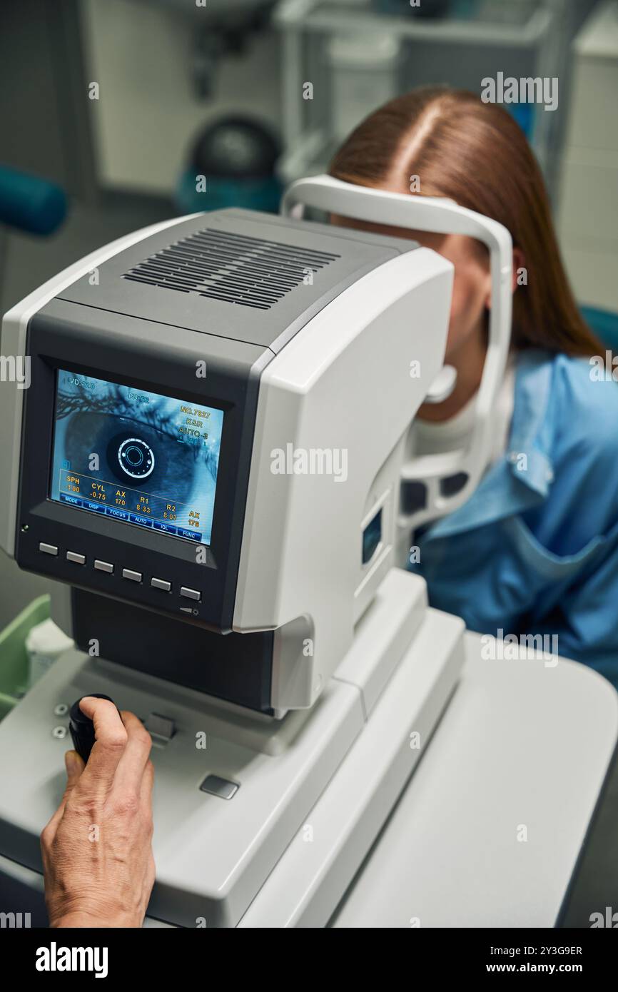 Screen displaying patient eye scan in progress Stock Photo - Alamy