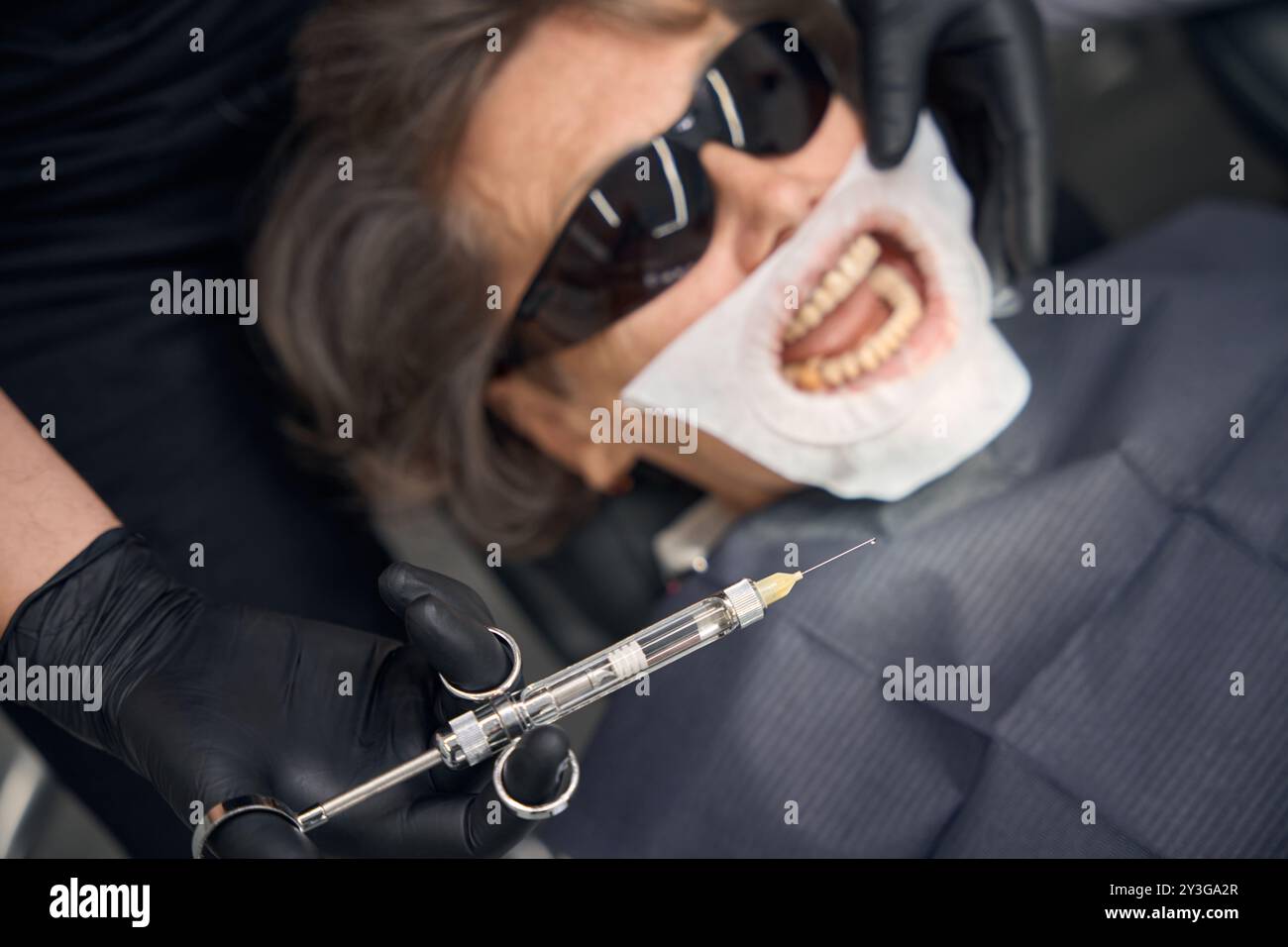 Dentist uses a special syringe for anesthesia Stock Photo - Alamy