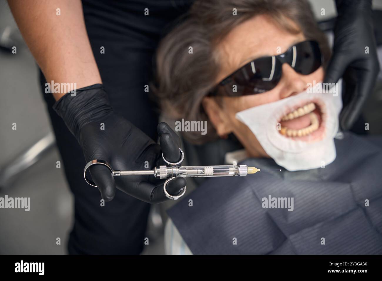 Dentist uses a special syringe for anesthesia Stock Photo - Alamy