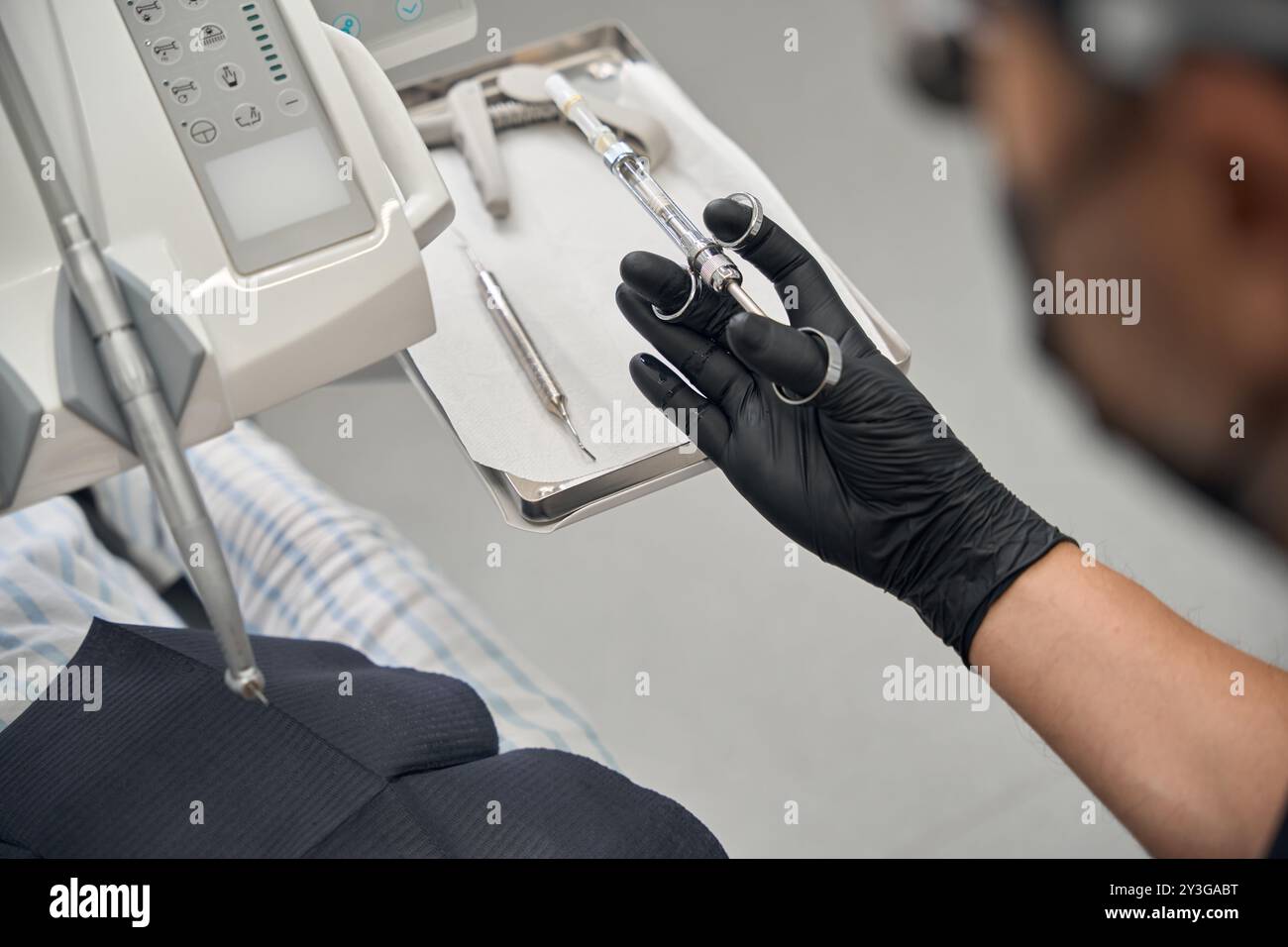 Dentist uses a special syringe Stock Photo - Alamy