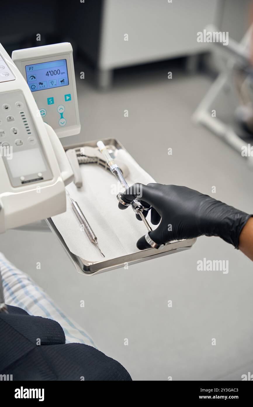 Dentist uses a special syringe at work Stock Photo - Alamy