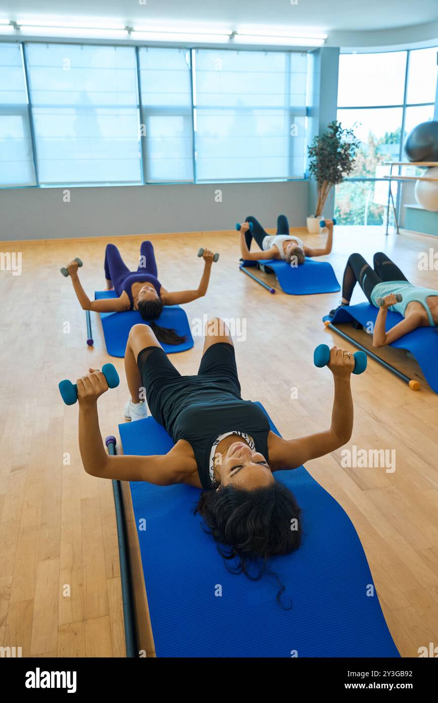 Energetic women perform exercises hi-res stock photography and images ...