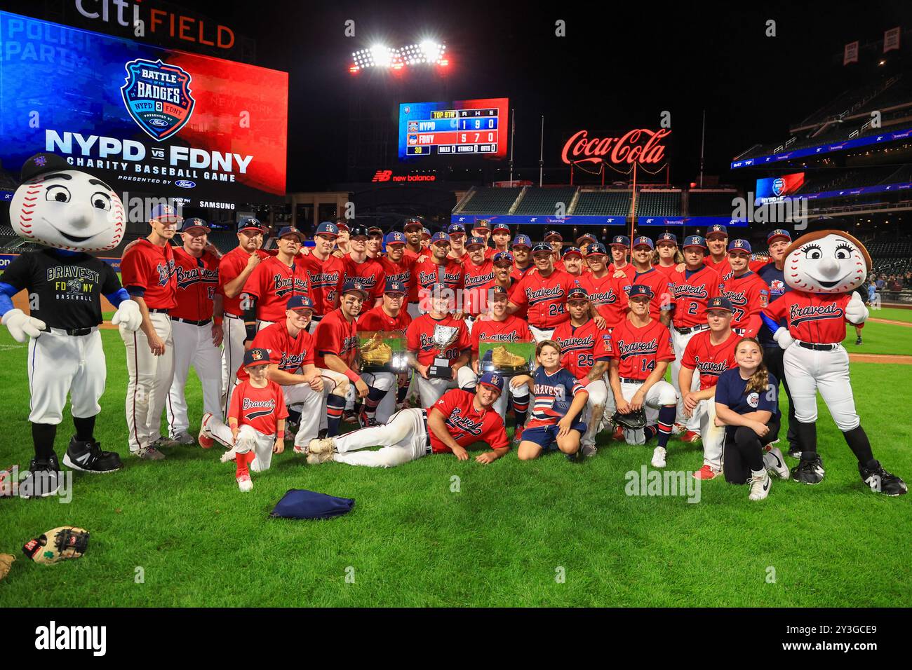 New York’s Bravest players pose for a photo after defeating the NYPD ...