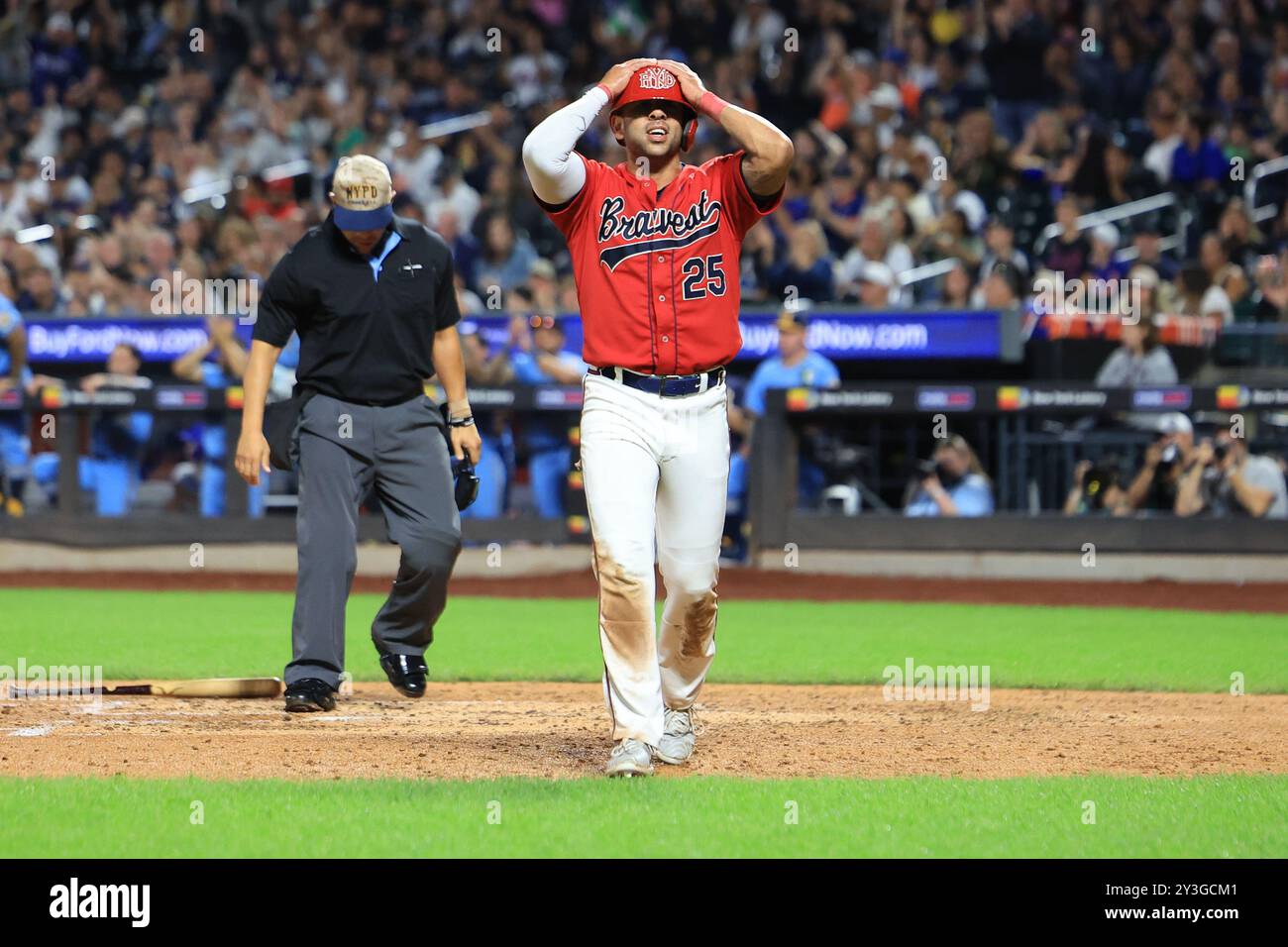 New York’s Bravest Kevin Diaz #25 reacts after being called out at home plate during the ...