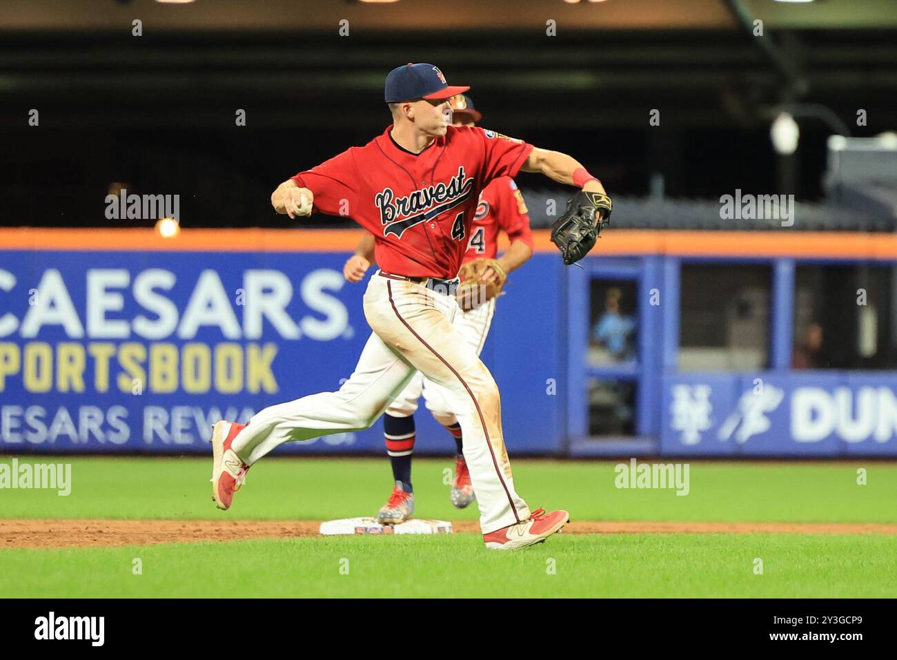 New York's Bravest shortstop Brian Luebcke #4 fields and throws to 1B ...