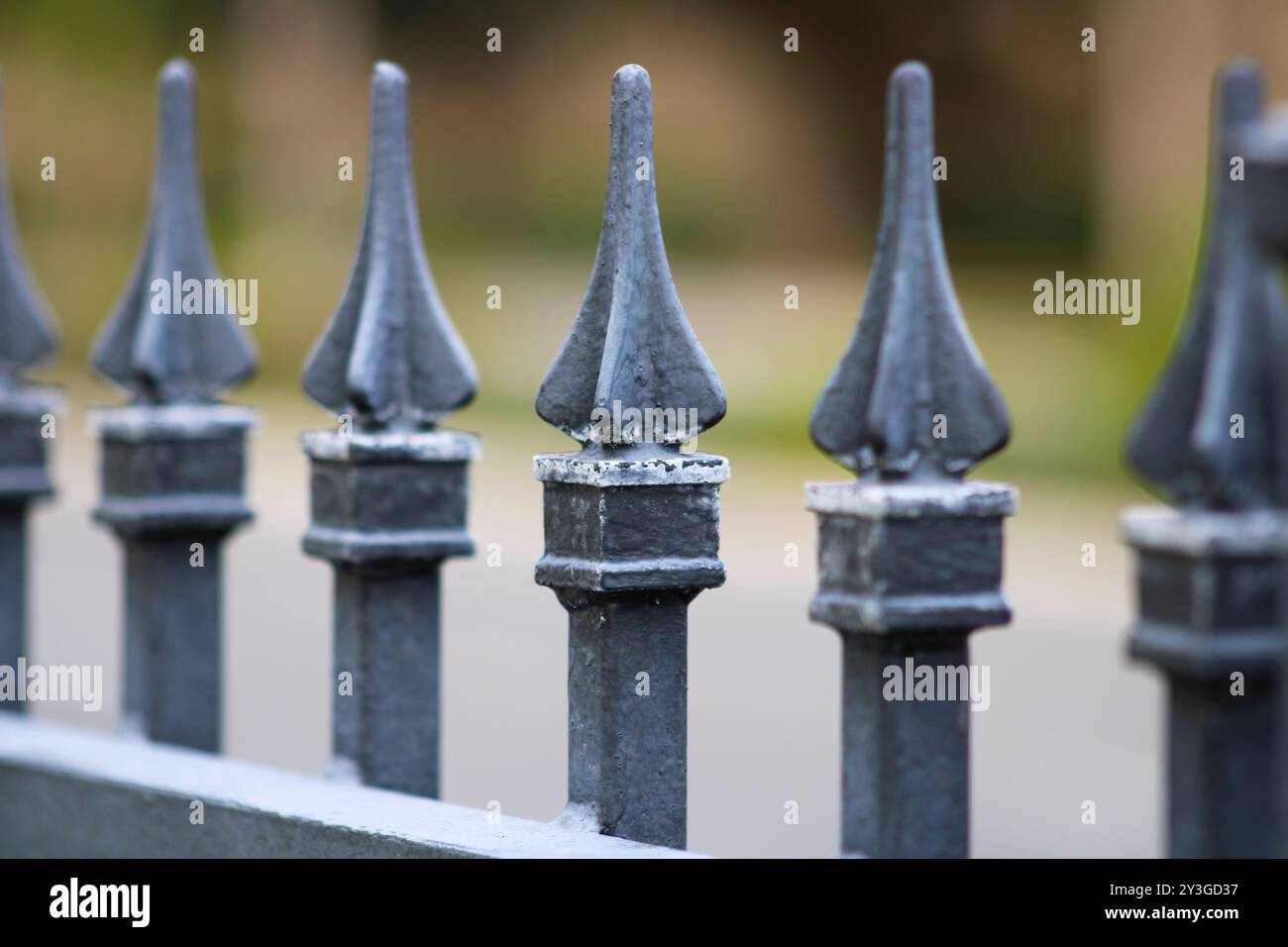 black wrought iron fence posts Stock Photo - Alamy