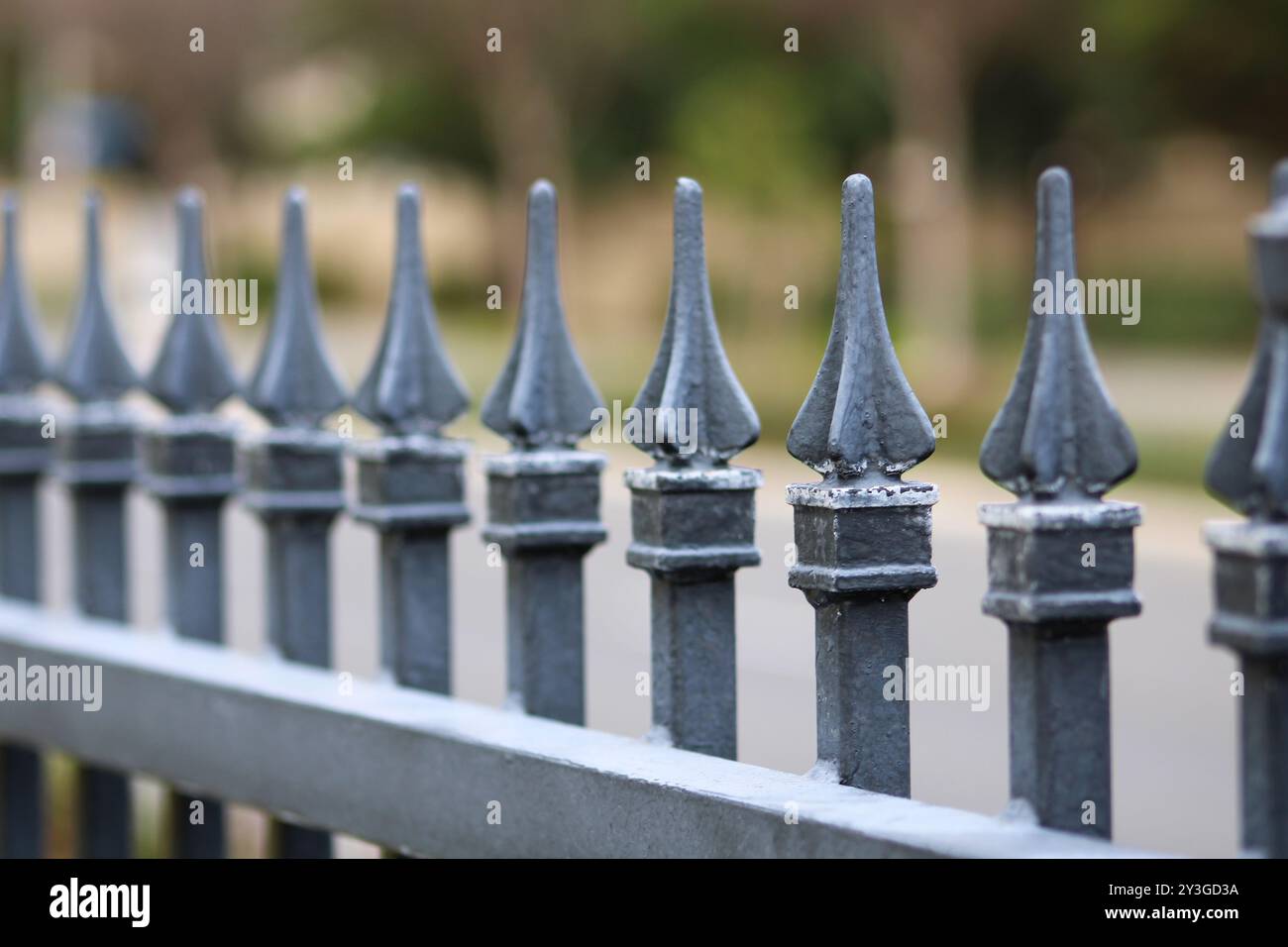 black wrought iron fence posts Stock Photo - Alamy
